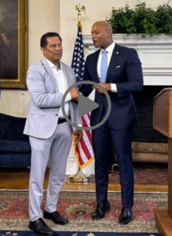 Governor Wes Moore congratulates Olympic Artist Jesse Raudales ...